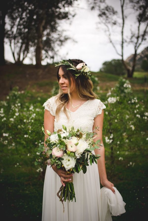 A romantic garden ceremony with a uniformed groom and boho bride ...